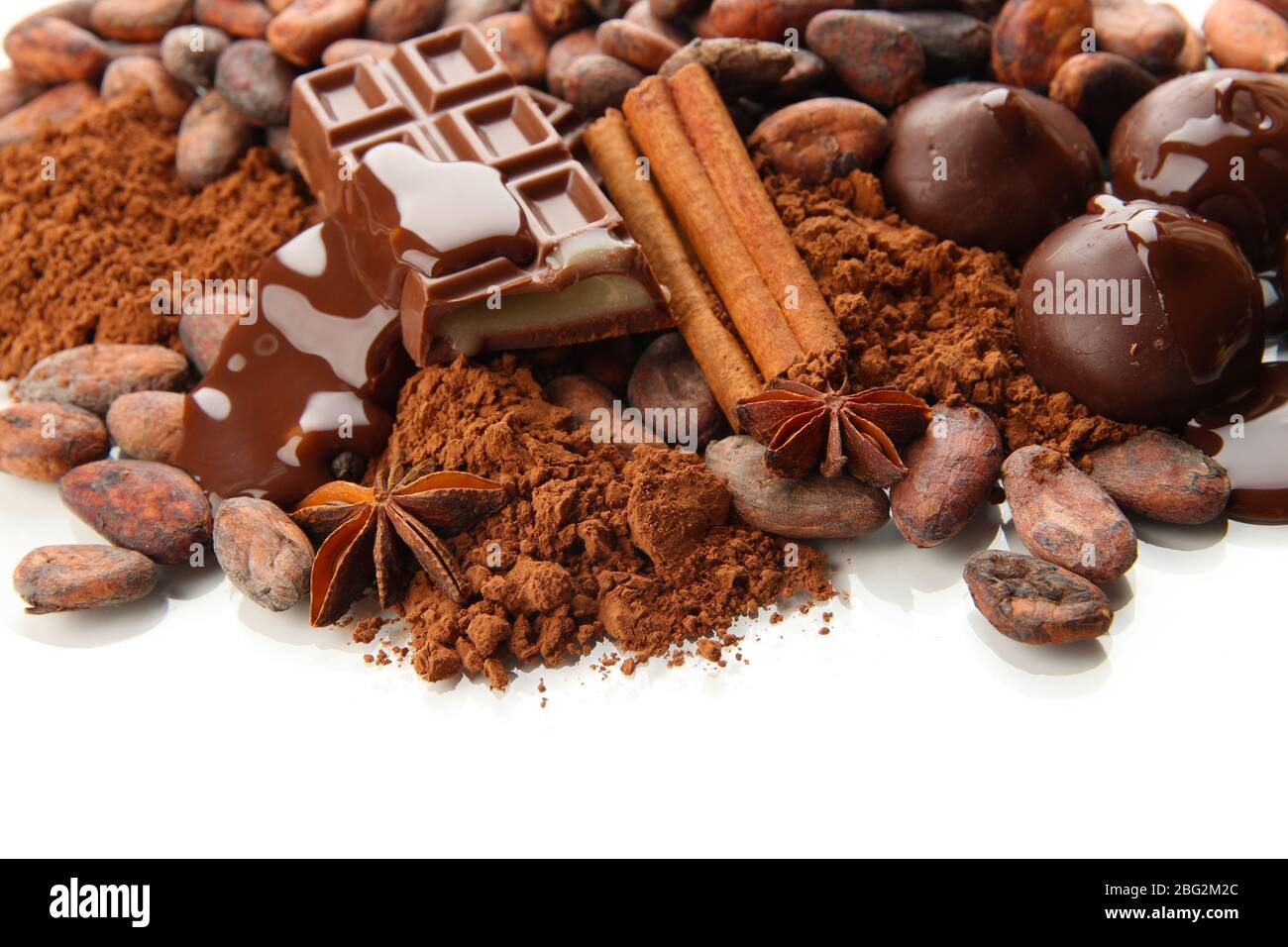 Composition of chocolate sweets, cocoa and spices, isolated on white ...