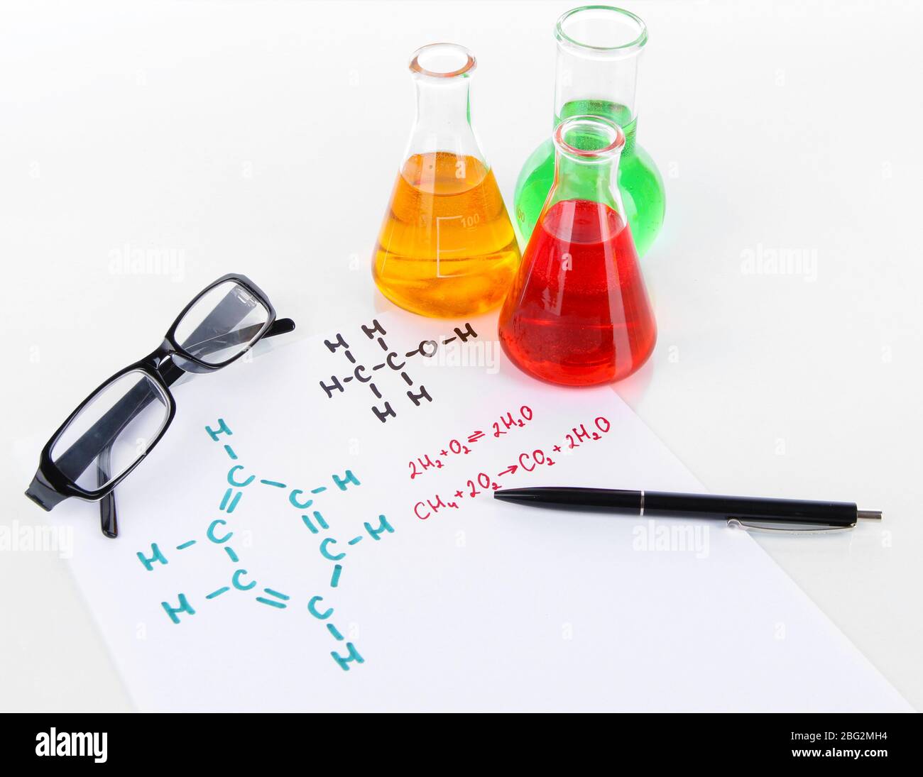 Test tubes with colorful liquids and formulas isolated on white Stock ...