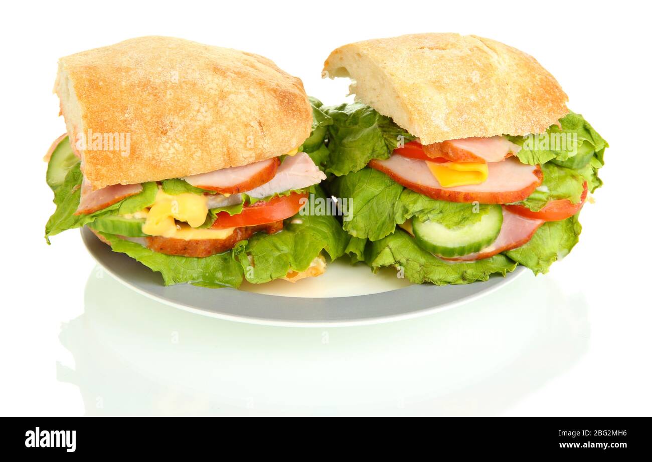 Sliced sandwich with ham and vegetables isolated on white Stock Photo ...