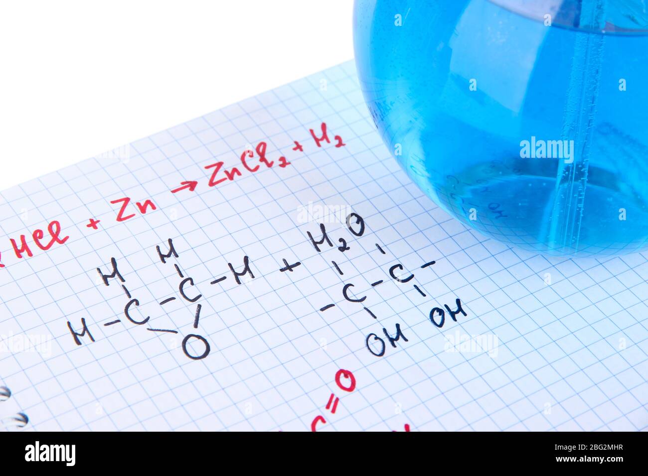 Test tube with colorful liquid and formulas isolated on white Stock ...