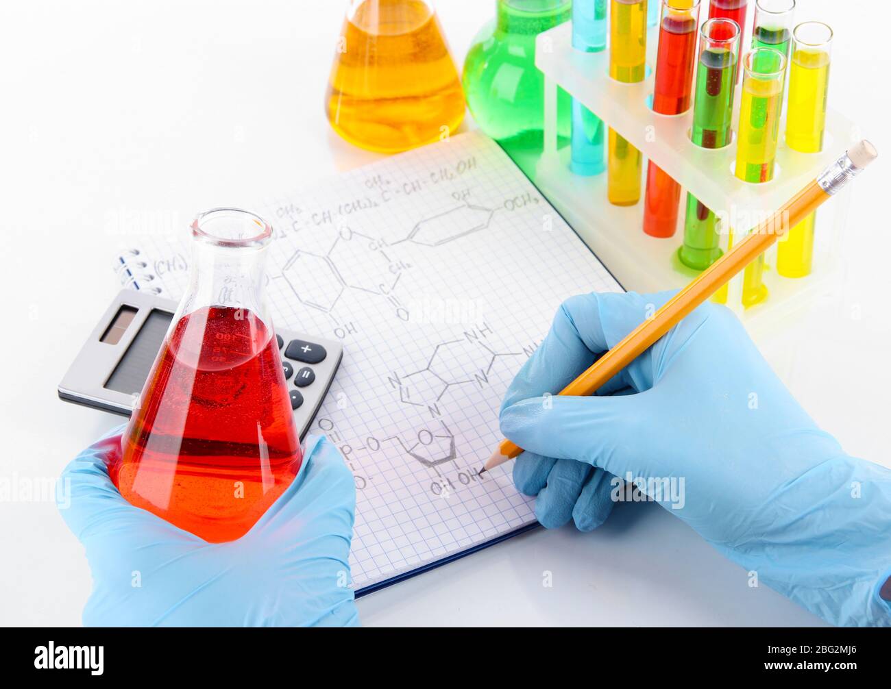 Hand scientist writing formulas isolated on white Stock Photo - Alamy