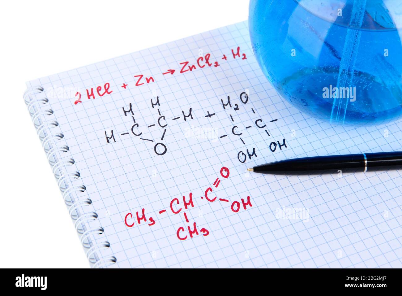Test tube with colorful liquid and formulas isolated on white Stock ...