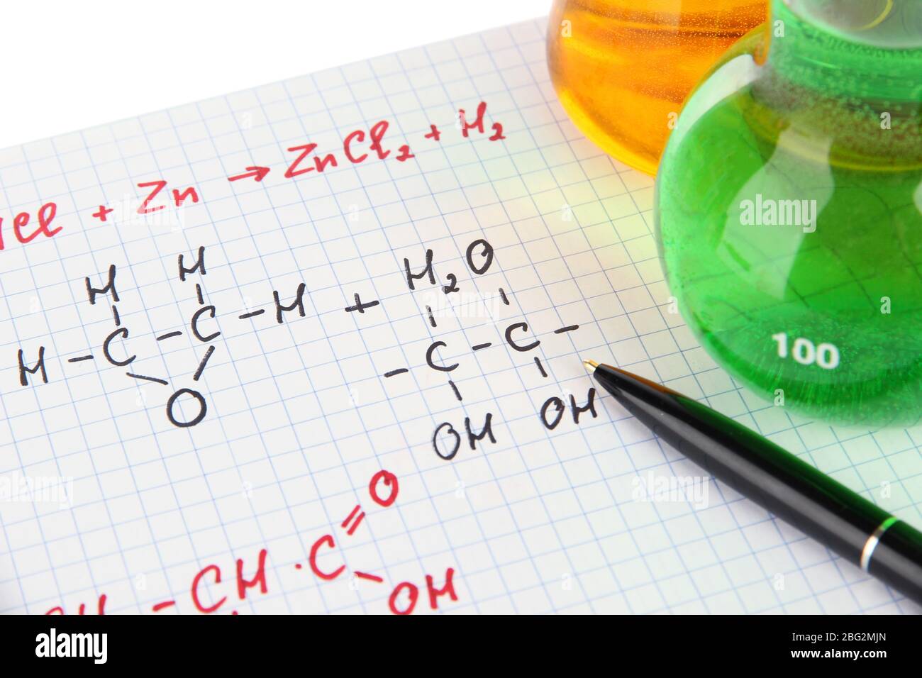 Test tubes with colorful liquids and formulas isolated on white Stock ...