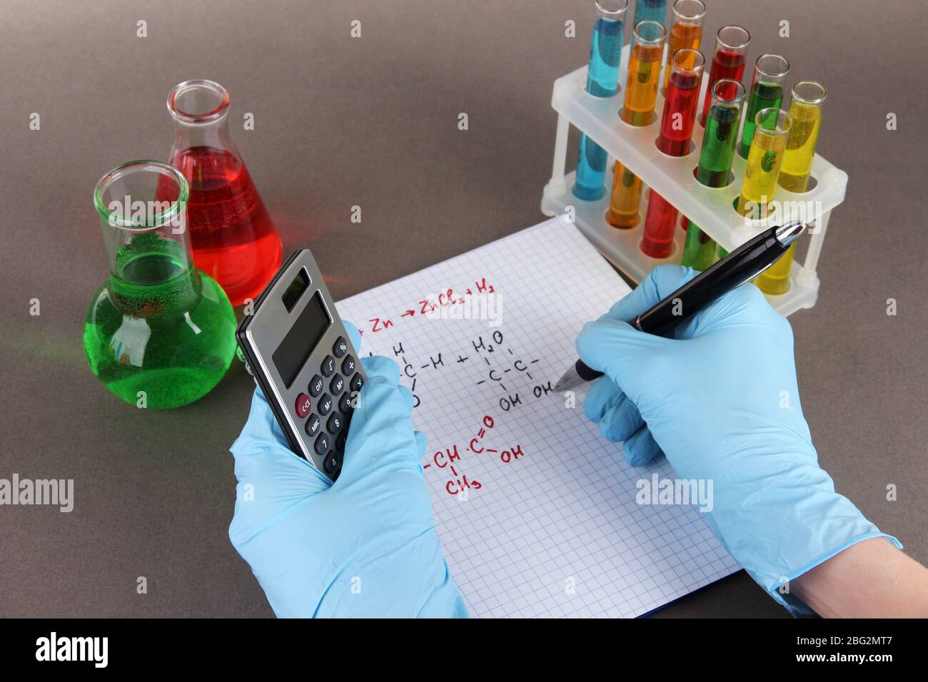 Hand scientist writing formulas Stock Photo - Alamy