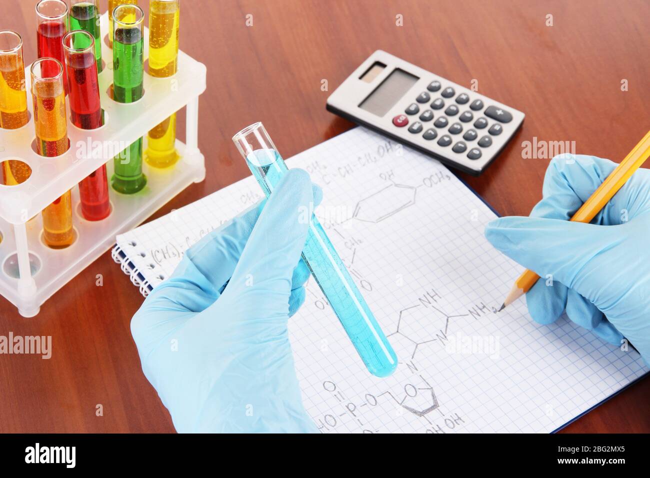 Hand scientist writing formulas hi-res stock photography and images - Alamy