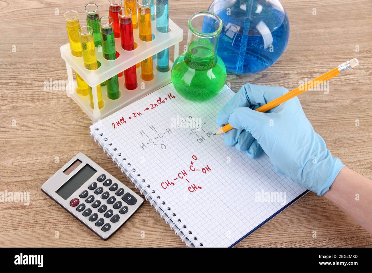 Hand scientist writing formulas Stock Photo - Alamy