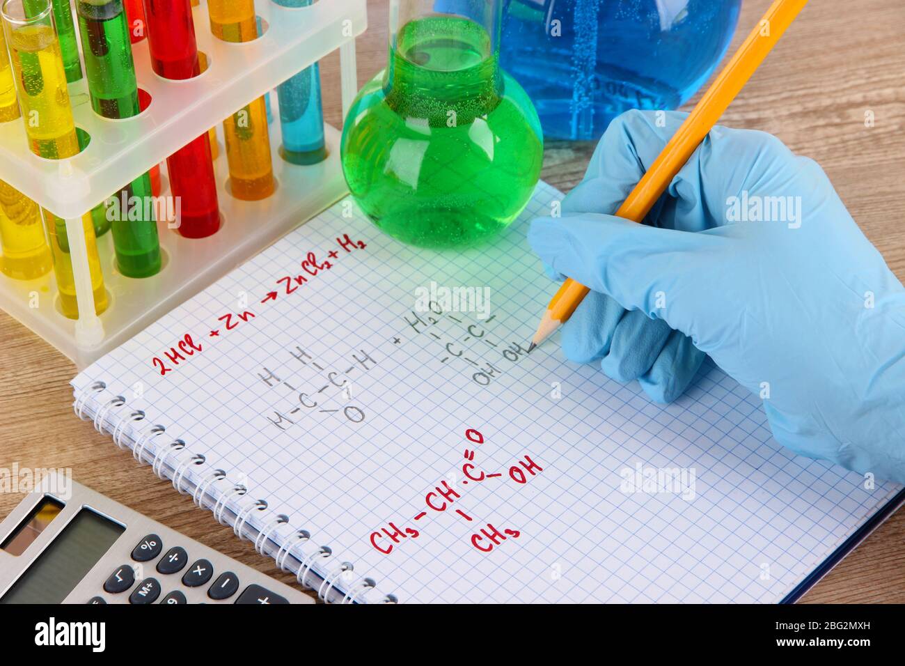 Hand scientist writing formulas Stock Photo - Alamy