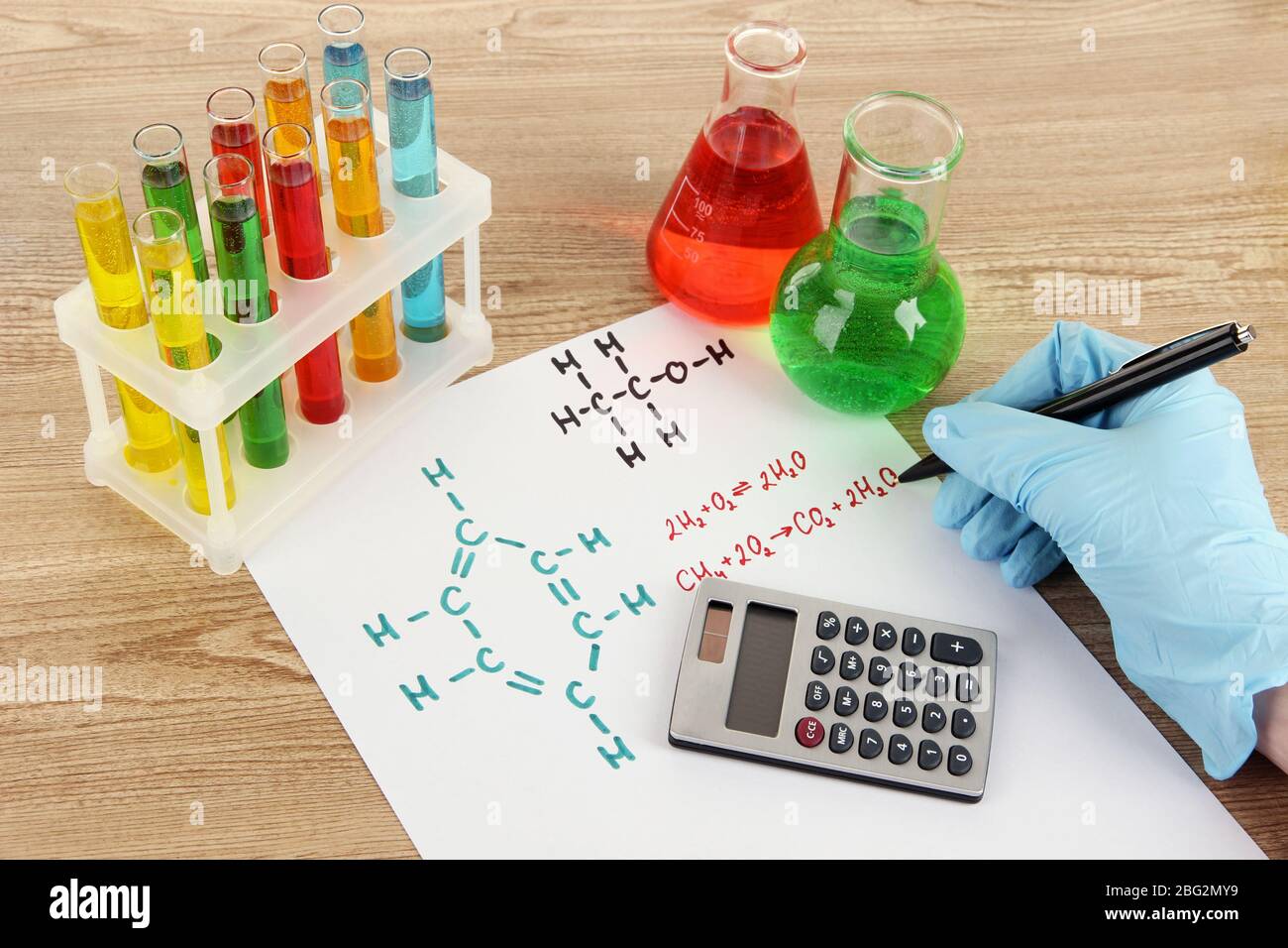 Hand scientist writing formulas Stock Photo - Alamy