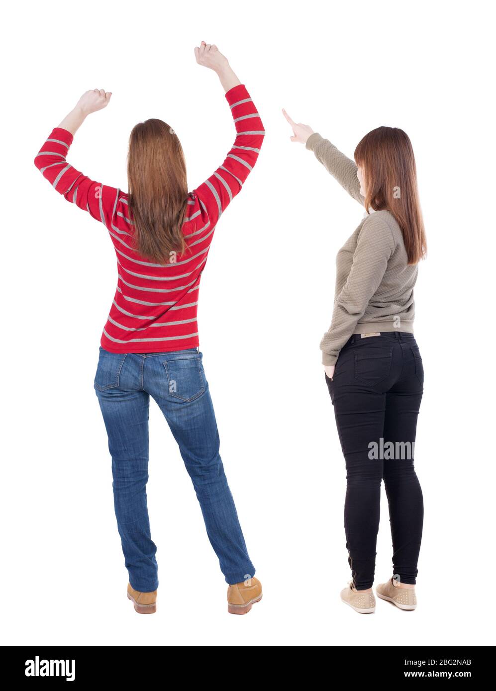 Back view of two pointing girl in sweater. Rear view people collection ...