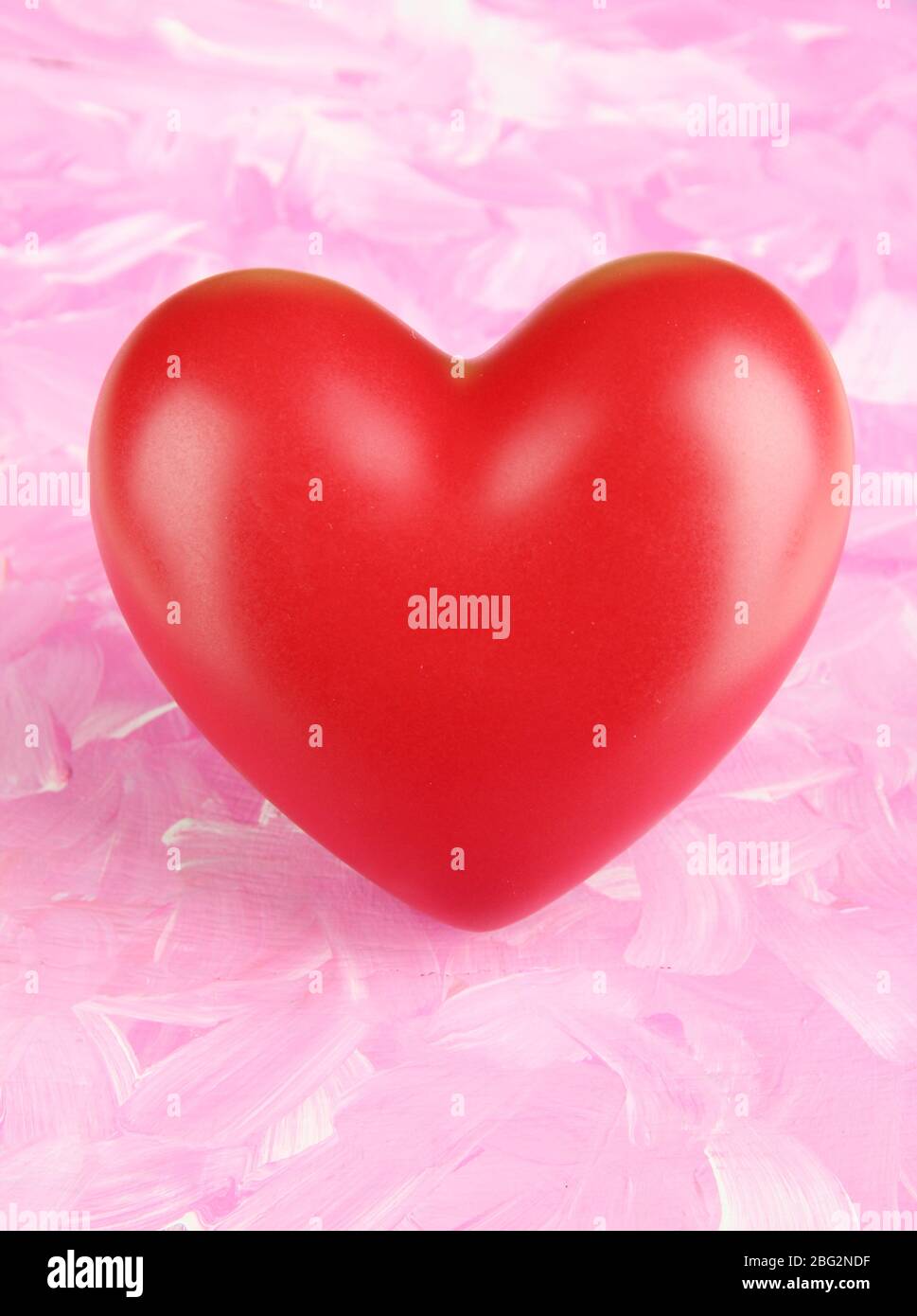Decorative red heart on color background Stock Photo - Alamy