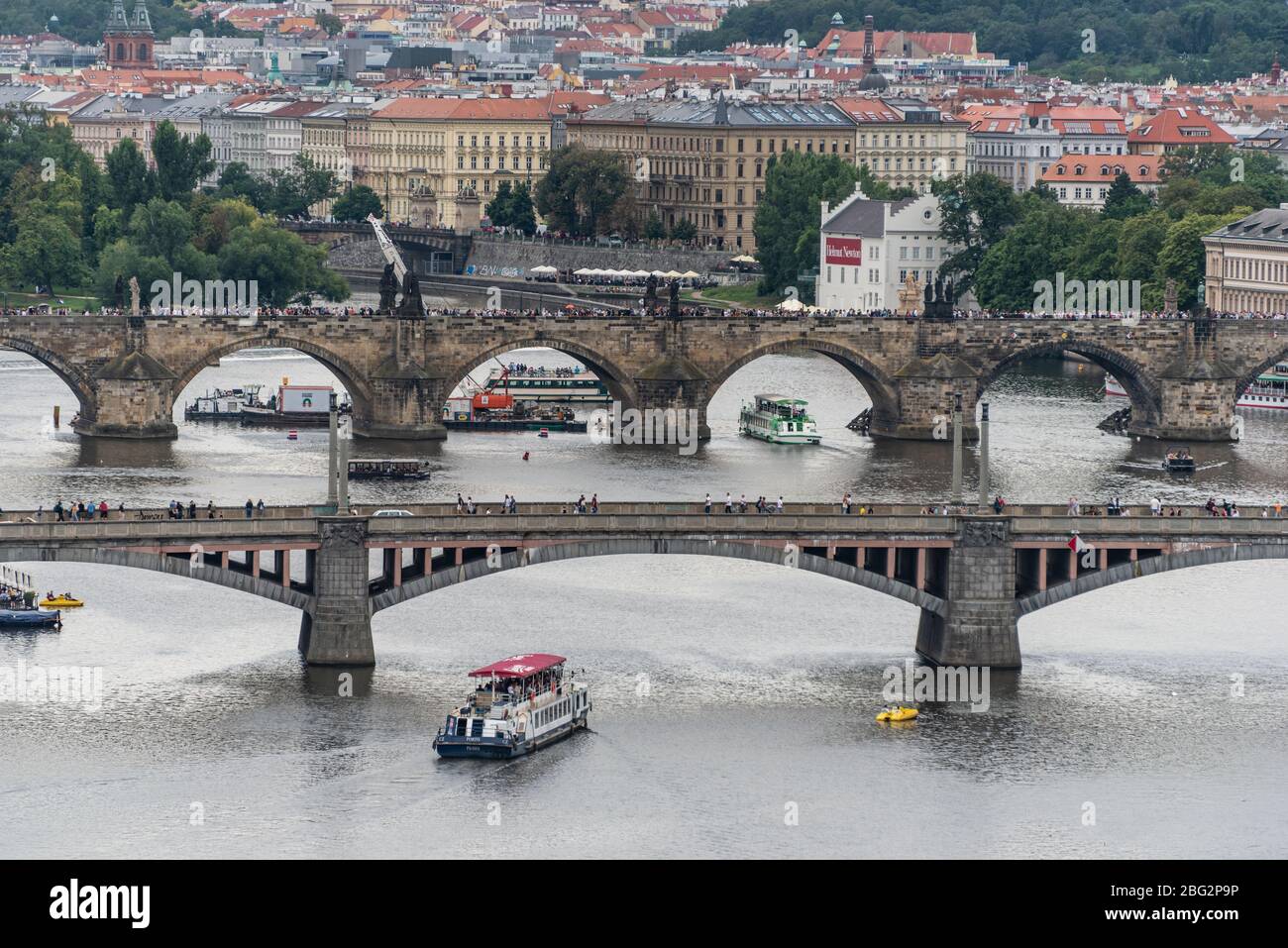 Mánes bridge and Charles bridge in Prague used by pedestrians, cars and ...