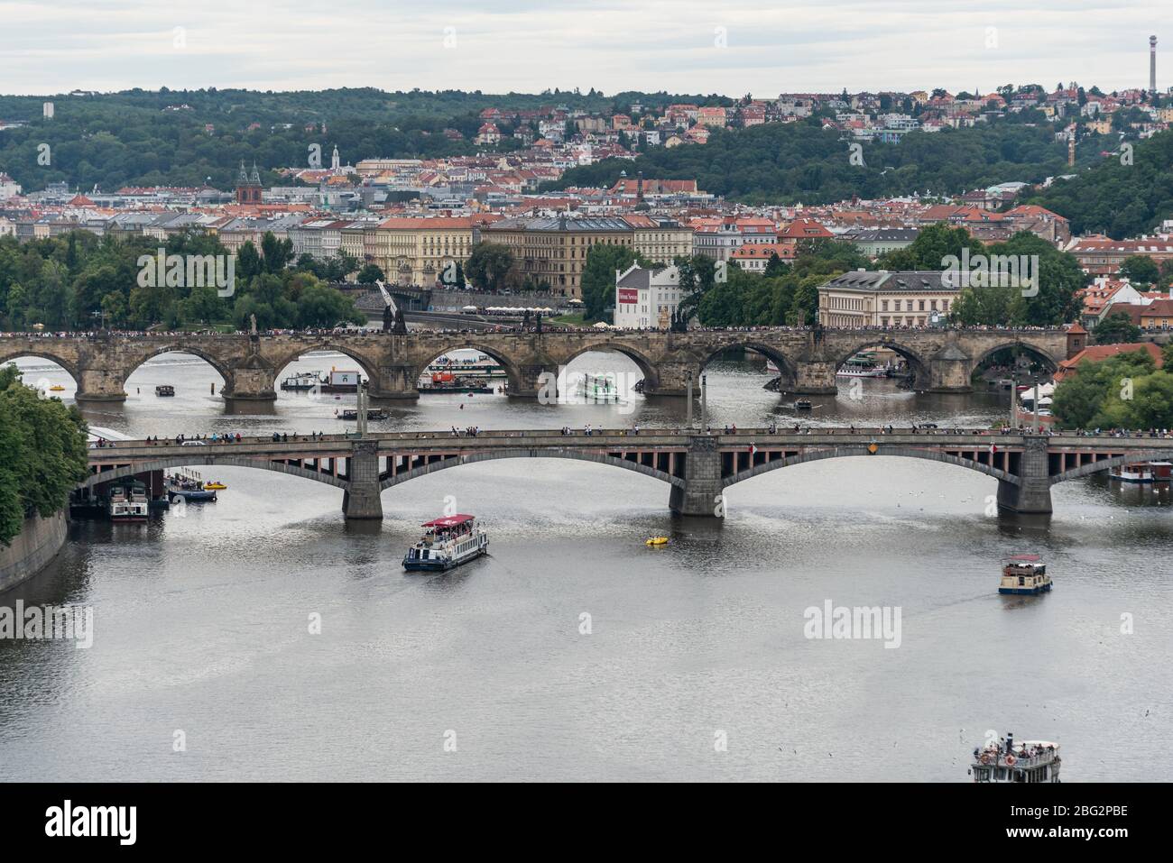 Mánes bridge and Charles bridge in Prague used by pedestrians, cars and ...