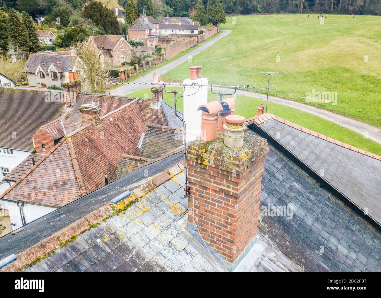 Rooftop chimney on old English cottage houses Stock Photo - Alamy
