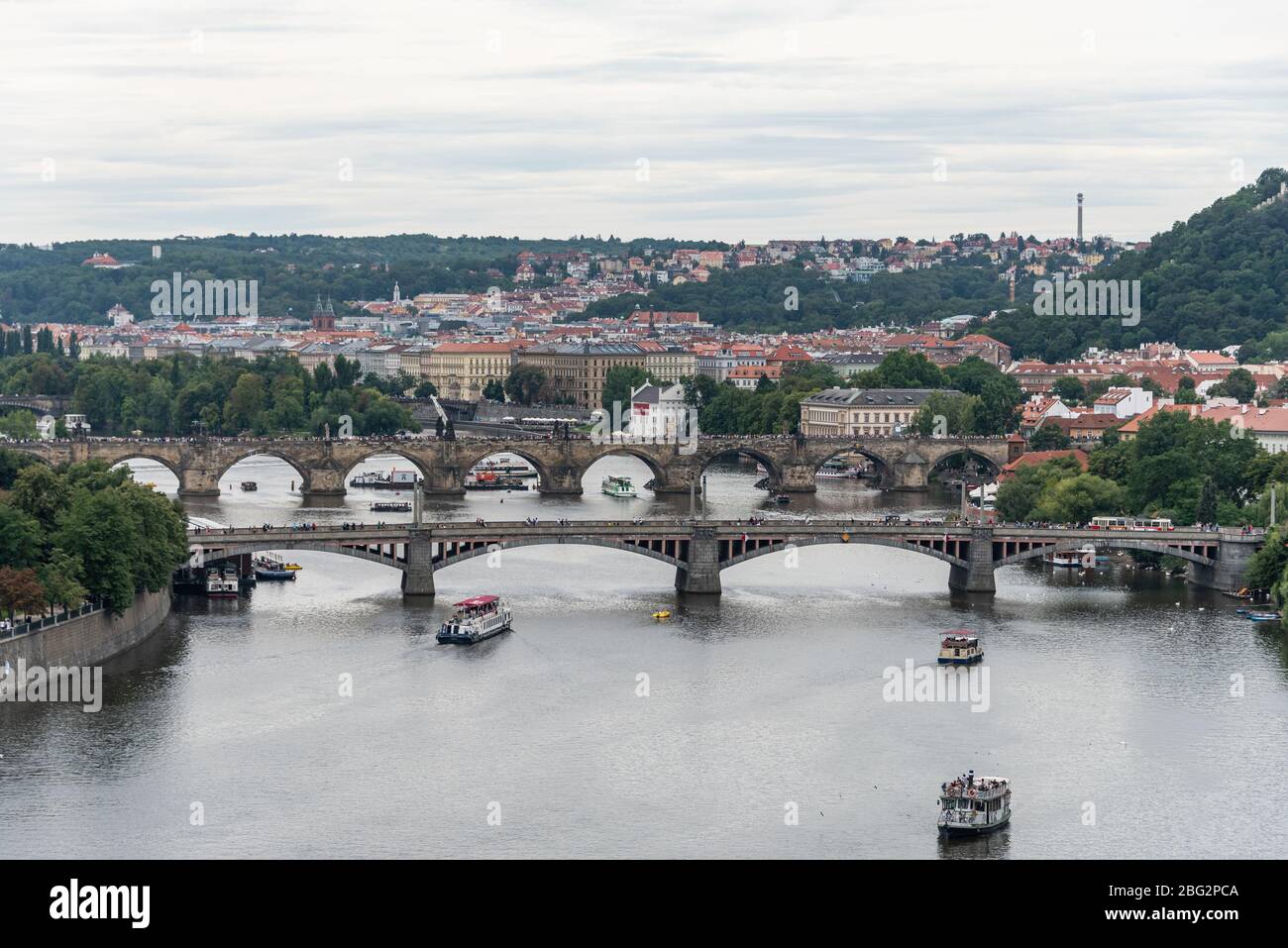 Mánes bridge and Charles bridge in Prague used by pedestrians, cars and ...