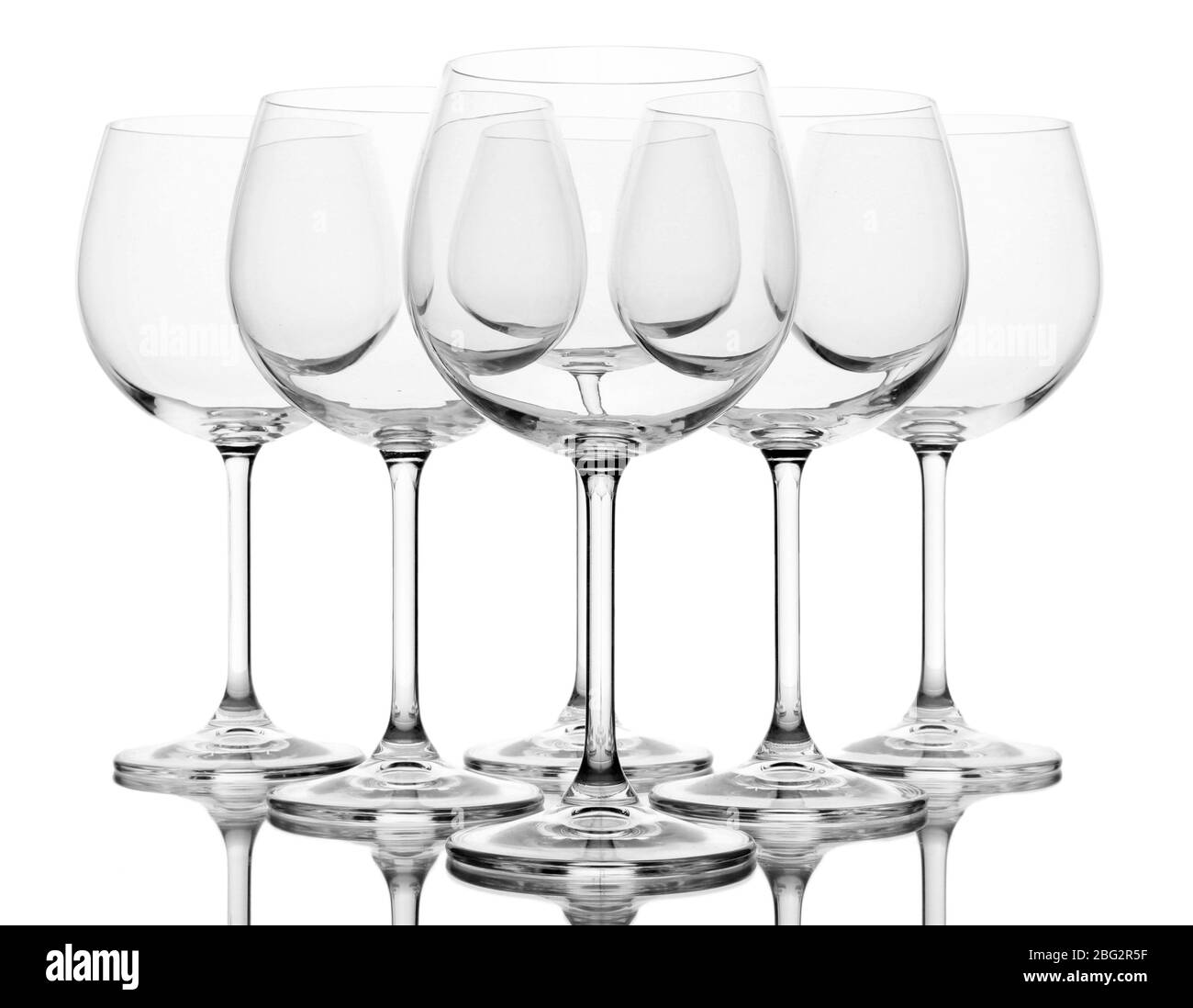 Empty wine glasses arranged and isolated on white Stock Photo - Alamy