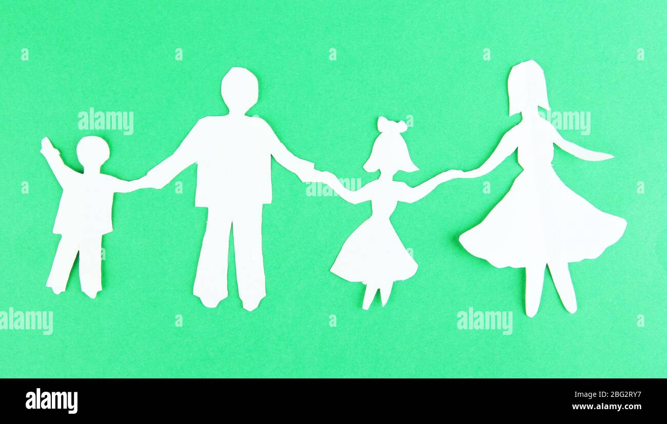 Paper people on color background Stock Photo - Alamy