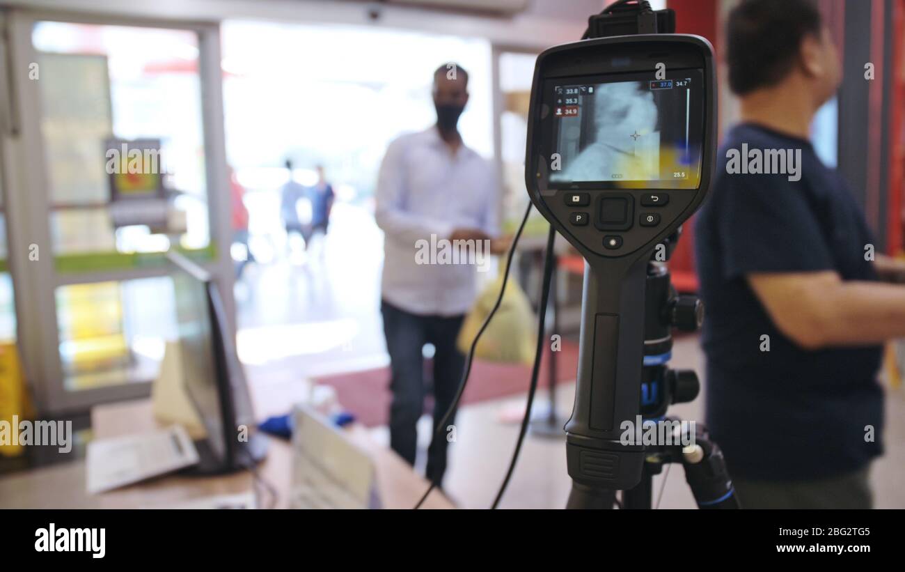 Temperature check at a supermarket, grocery store with a thermal ...