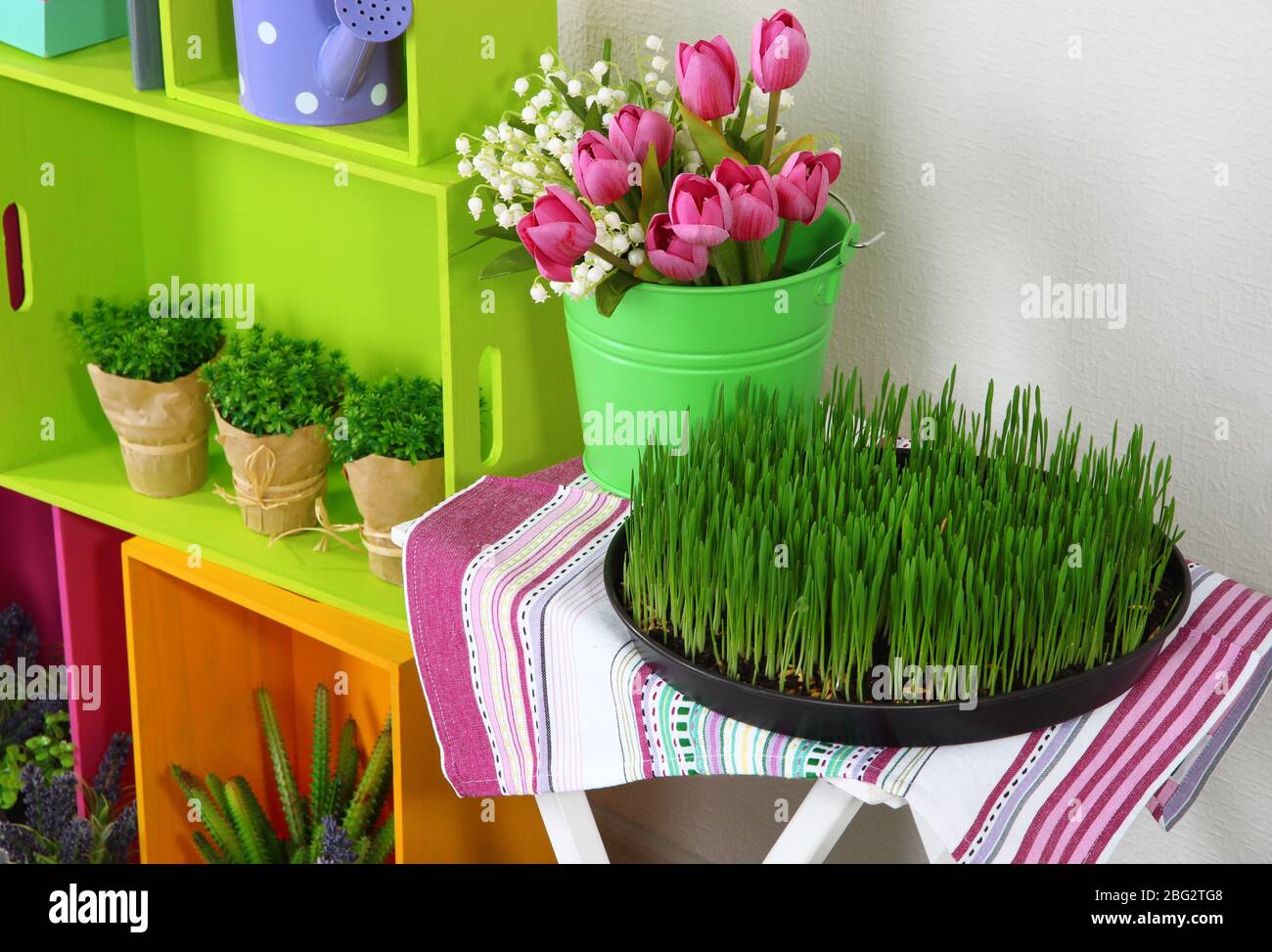 Colorful shelves and table with decorative elements and flowers Stock ...