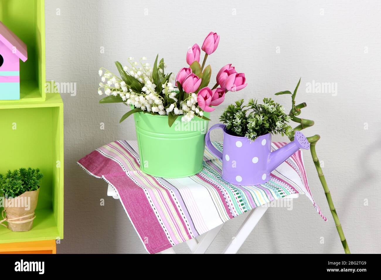 Colorful shelves and table with decorative elements and flowers Stock ...