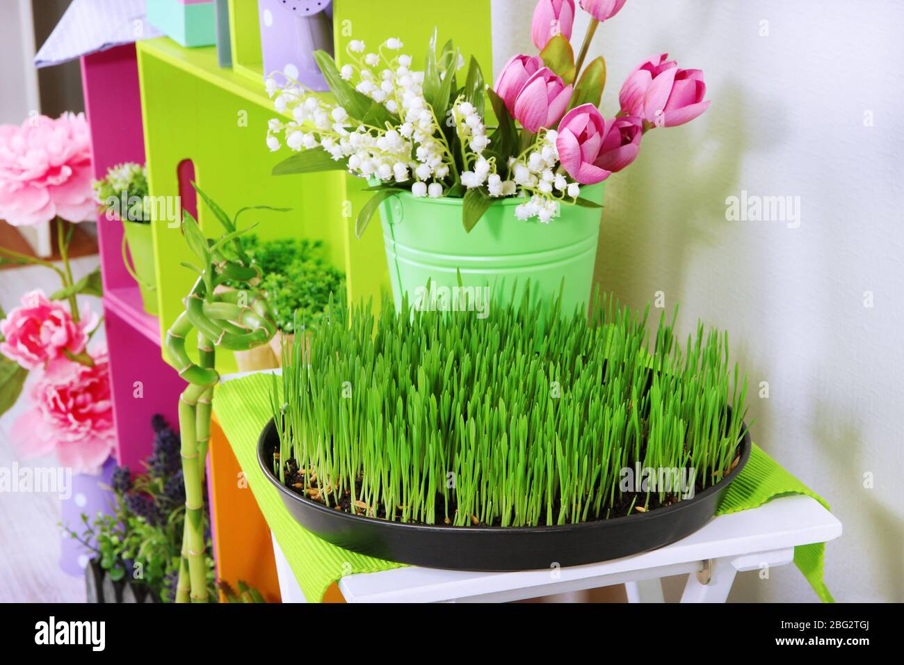 Colorful shelves and table with decorative elements and flowers Stock ...