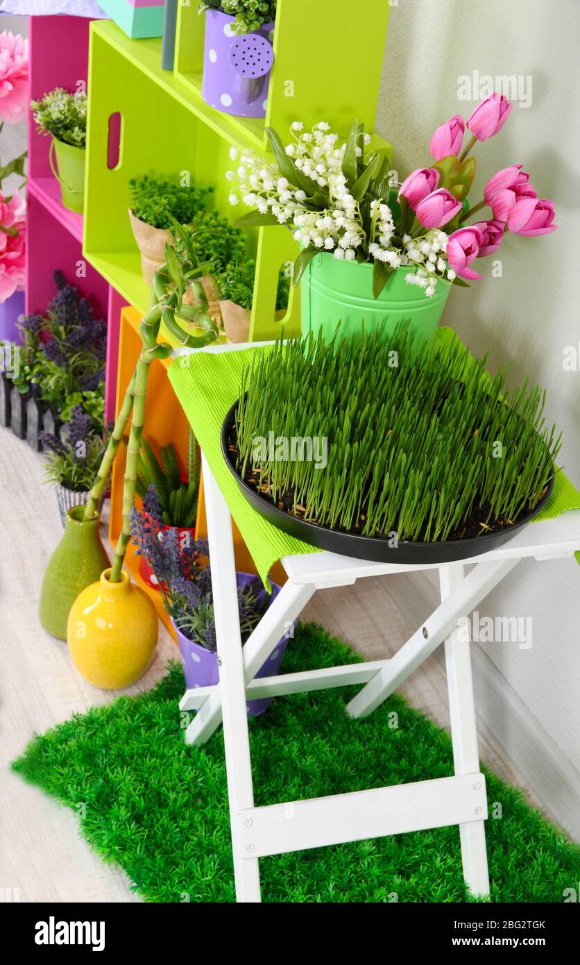 Colorful shelves and table with decorative elements and flowers Stock ...
