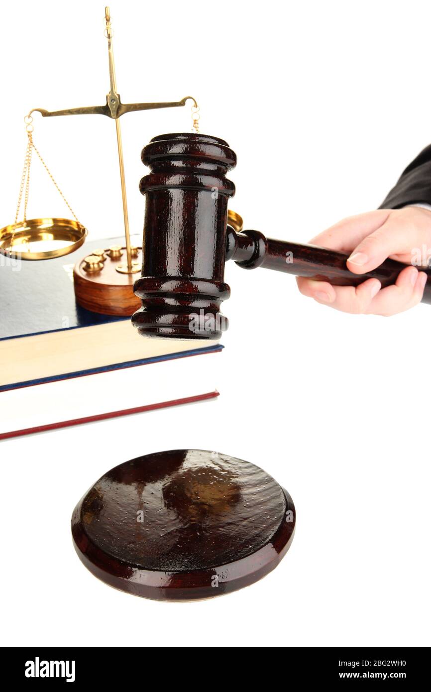 Judge's gavel in hand isolated on white Stock Photo - Alamy