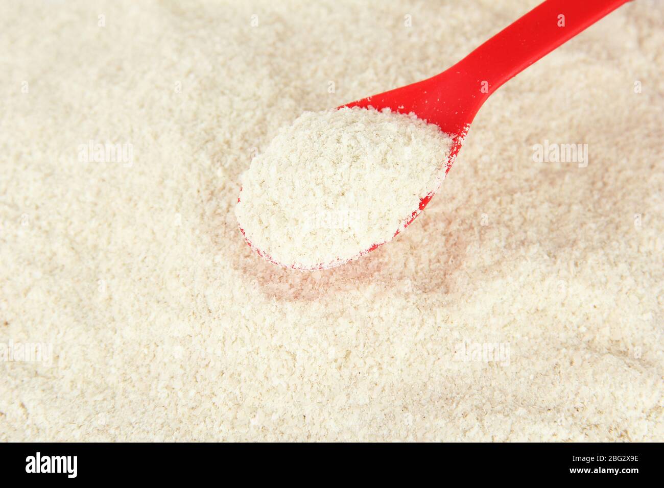 Powdered milk with spoon for baby close-up Stock Photo - Alamy