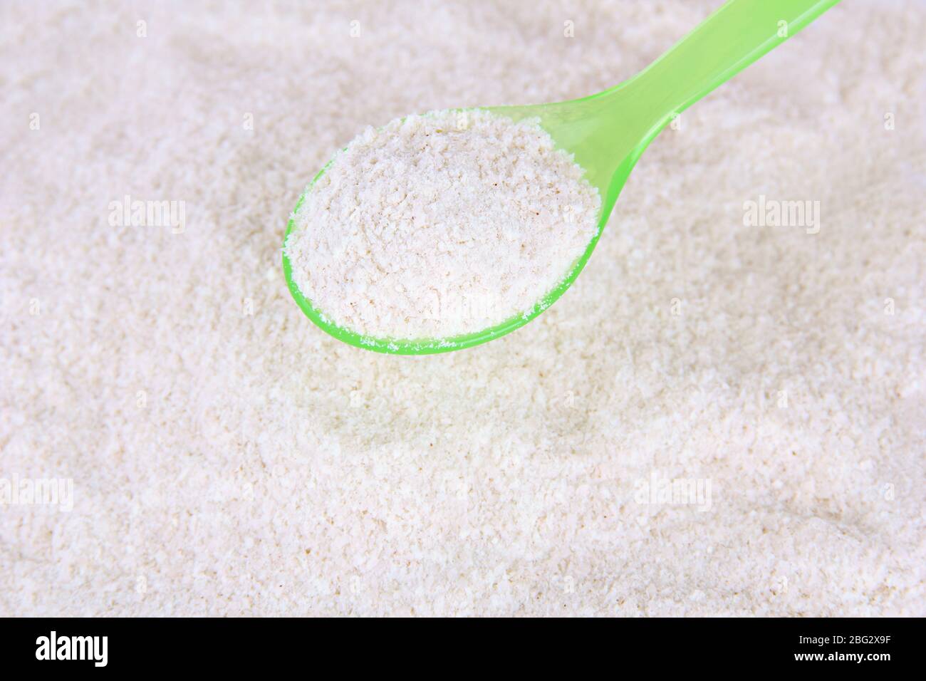 Powdered milk with spoon for baby close-up Stock Photo - Alamy