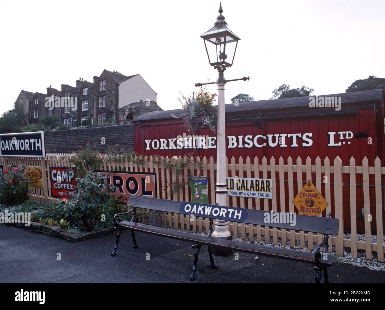Oakworth station with milk churns, old luggage cart, enamel 1950s ...