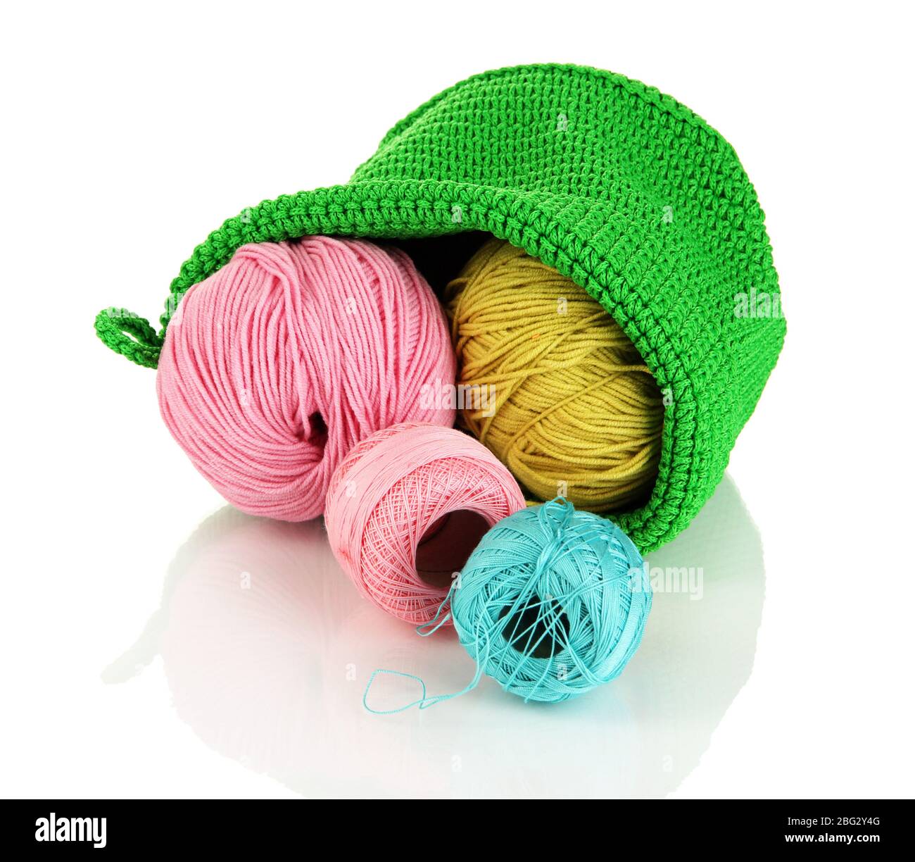Colorful yarn for knitting in green basket isolated on white Stock ...