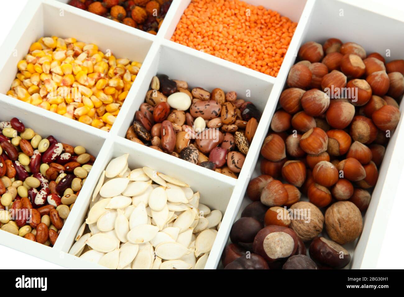 Assortment of chestnut,beans,dry briar, nuts etc in white wooden box ...