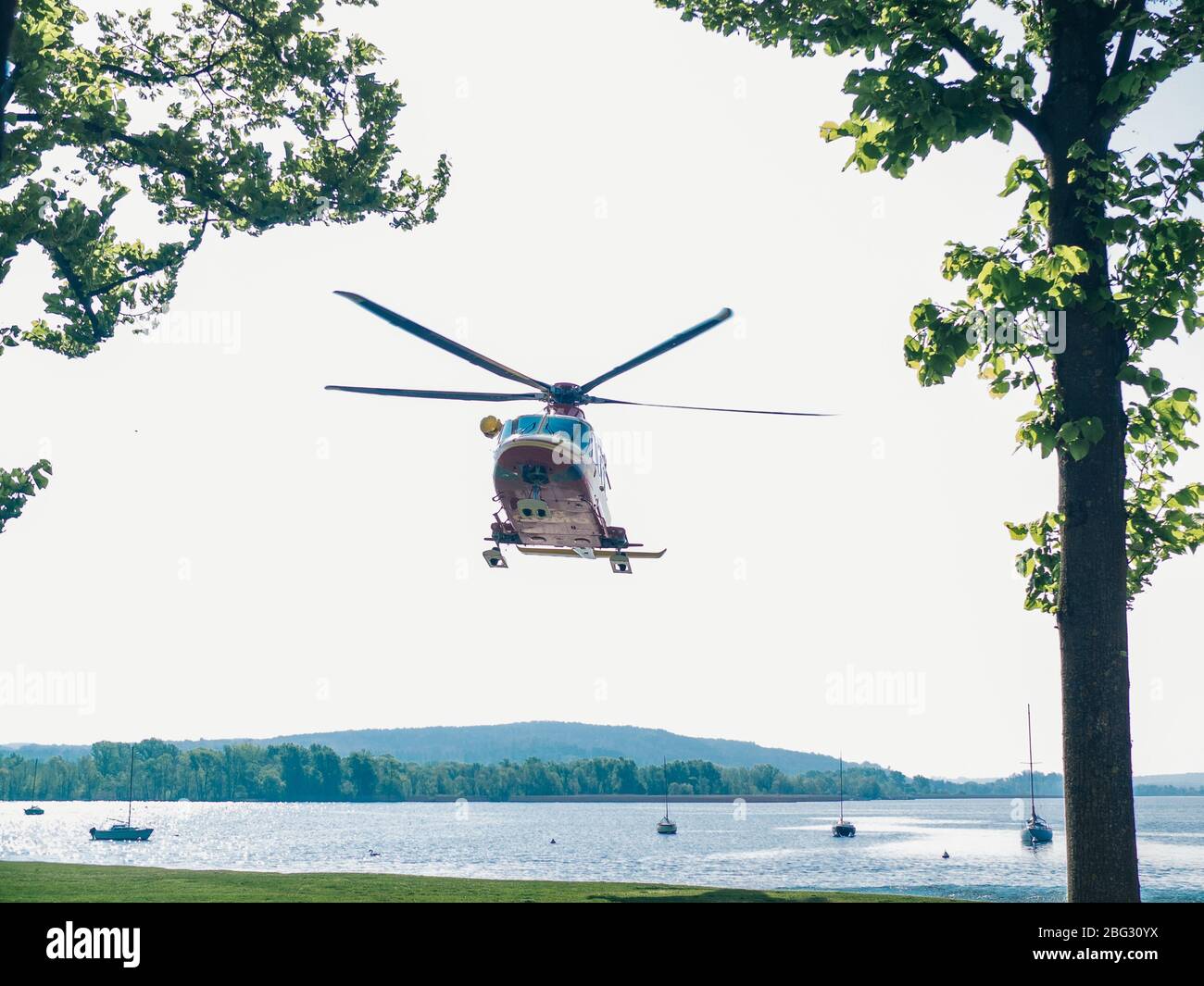first aid helicopter landing in a public park Stock Photo - Alamy