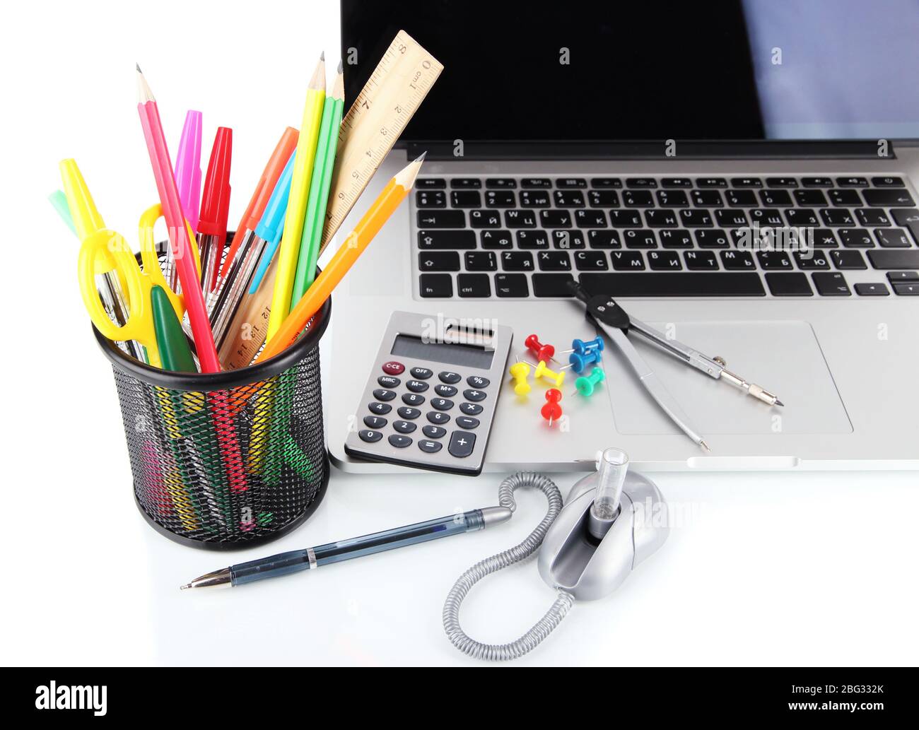 Laptop with stationery isolated on white Stock Photo - Alamy