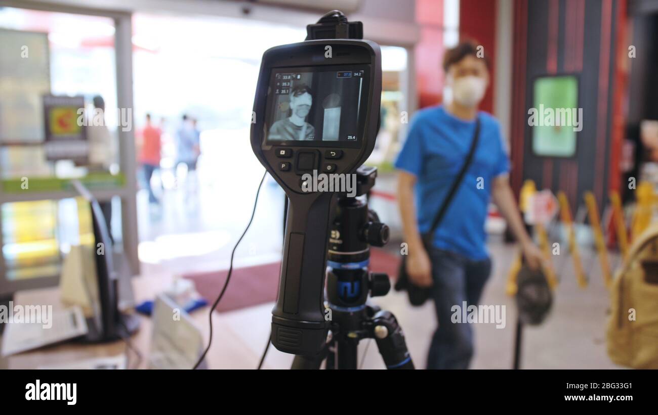 Temperature check at a supermarket, grocery store with a thermal ...