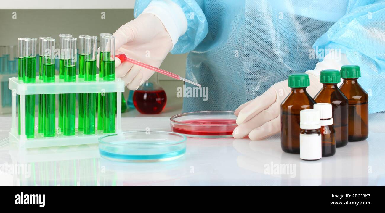 Scientist conducting research in laboratory close up Stock Photo - Alamy