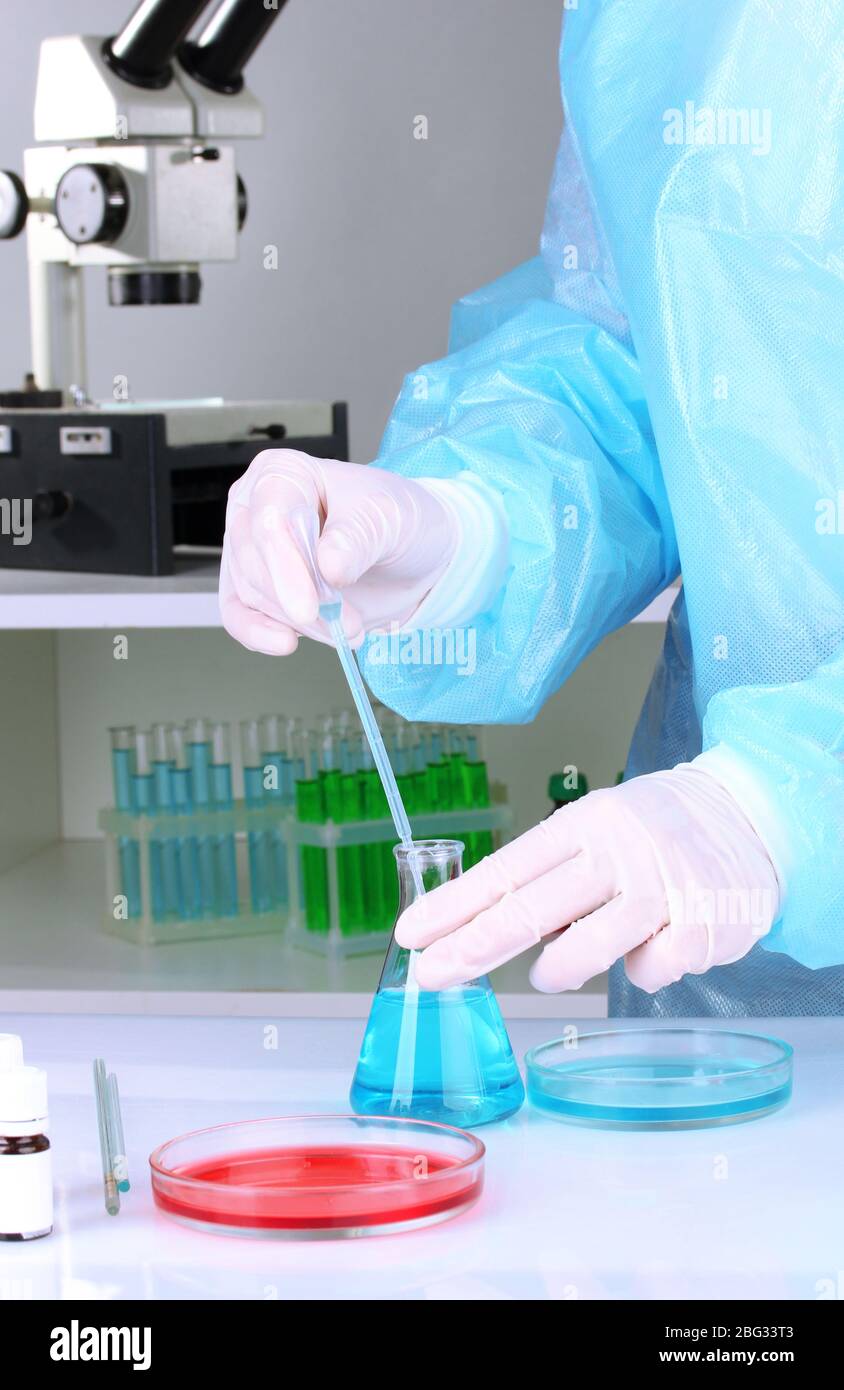 Scientist conducting research in laboratory close up Stock Photo - Alamy