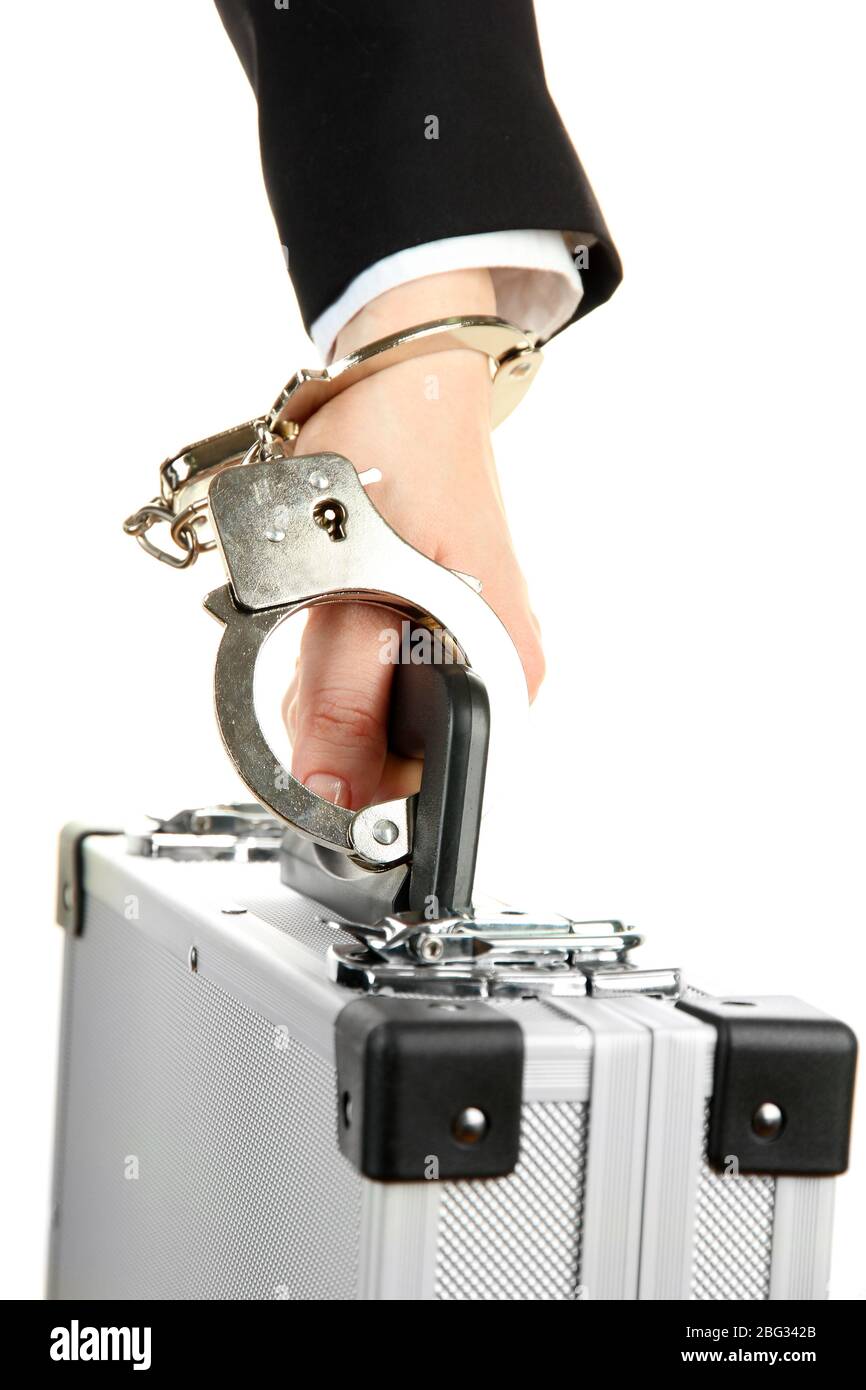 Hand with handcuff and suitcase, isolated on white Stock Photo - Alamy