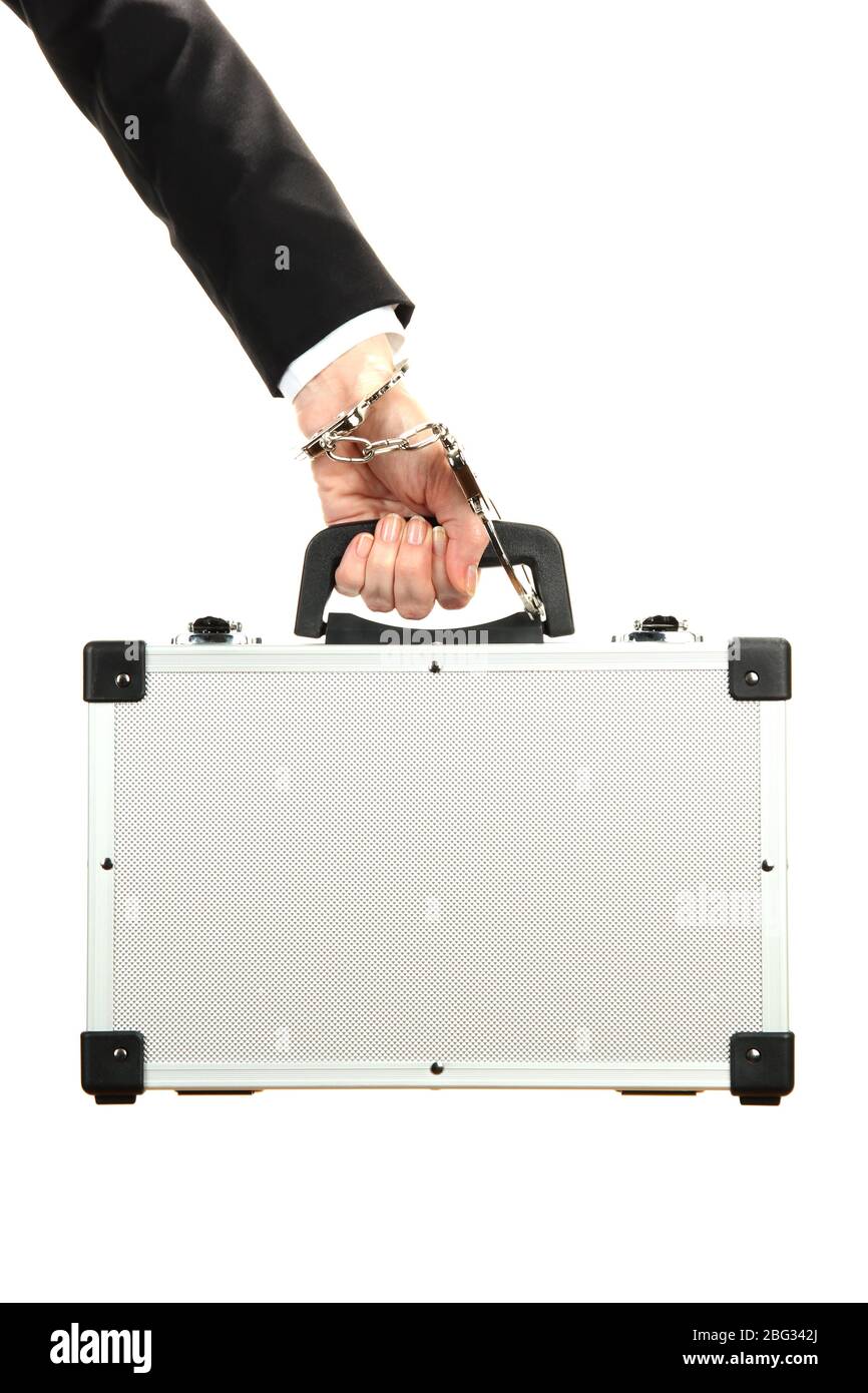 Hand with handcuff and suitcase, isolated on white Stock Photo - Alamy
