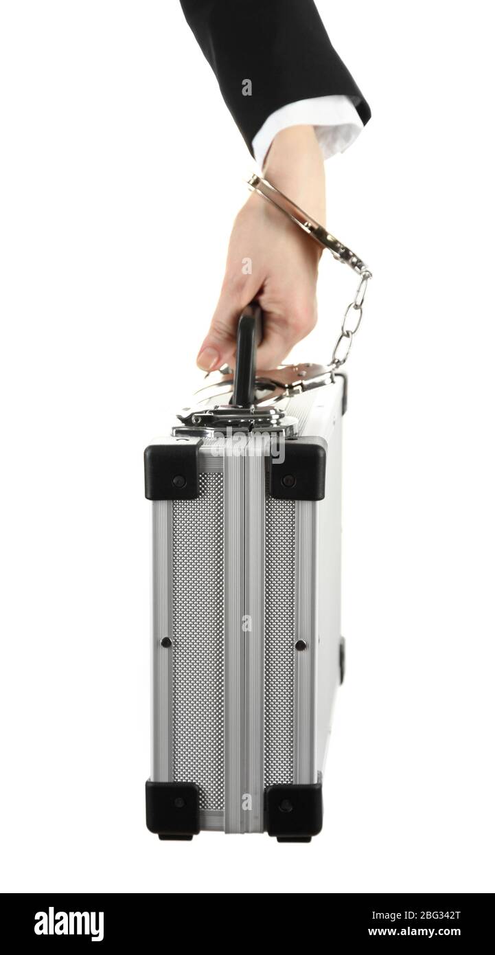 Hand with handcuff and suitcase, isolated on white Stock Photo - Alamy