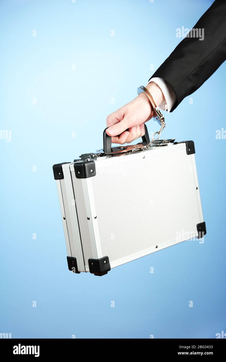 Metal suitcase handcuffs hi-res stock photography and images - Alamy