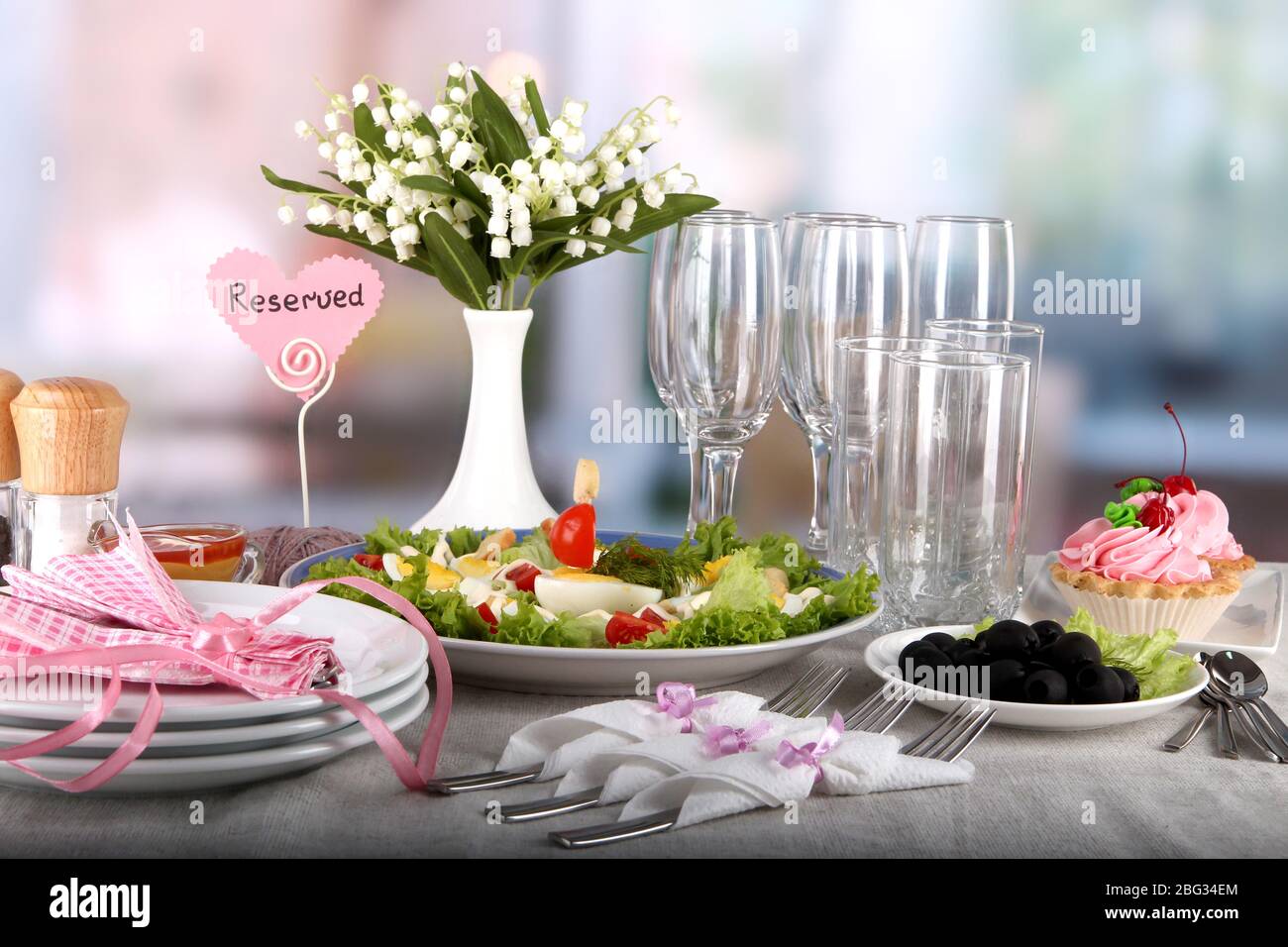 Table setting on room background Stock Photo - Alamy