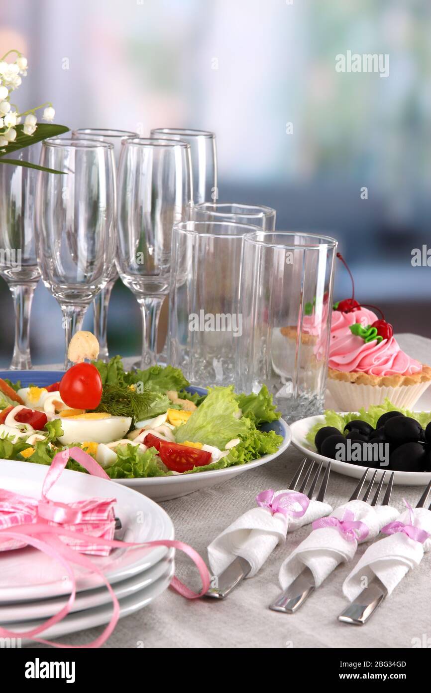 Table setting on room background Stock Photo - Alamy