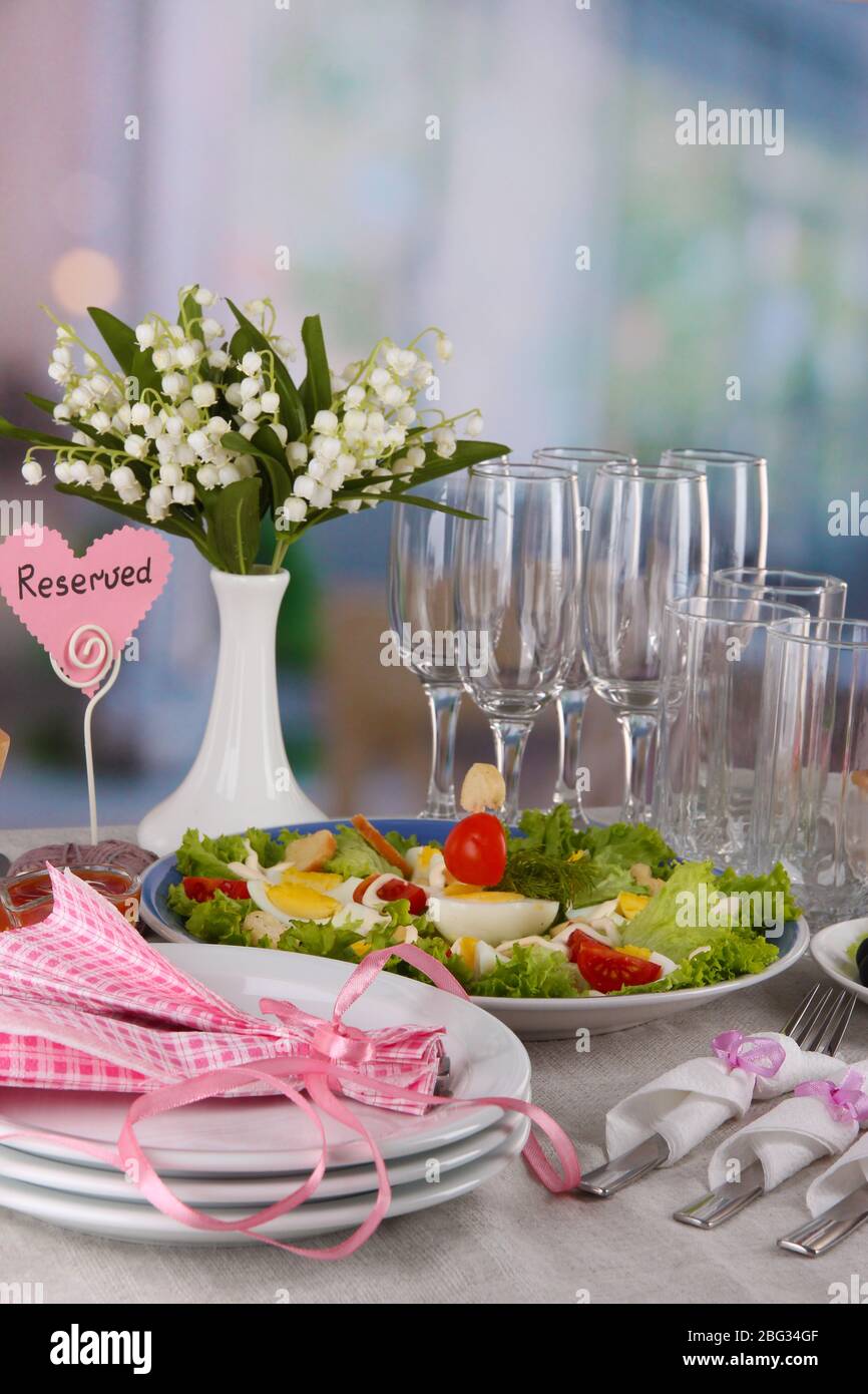 Table setting on room background Stock Photo - Alamy