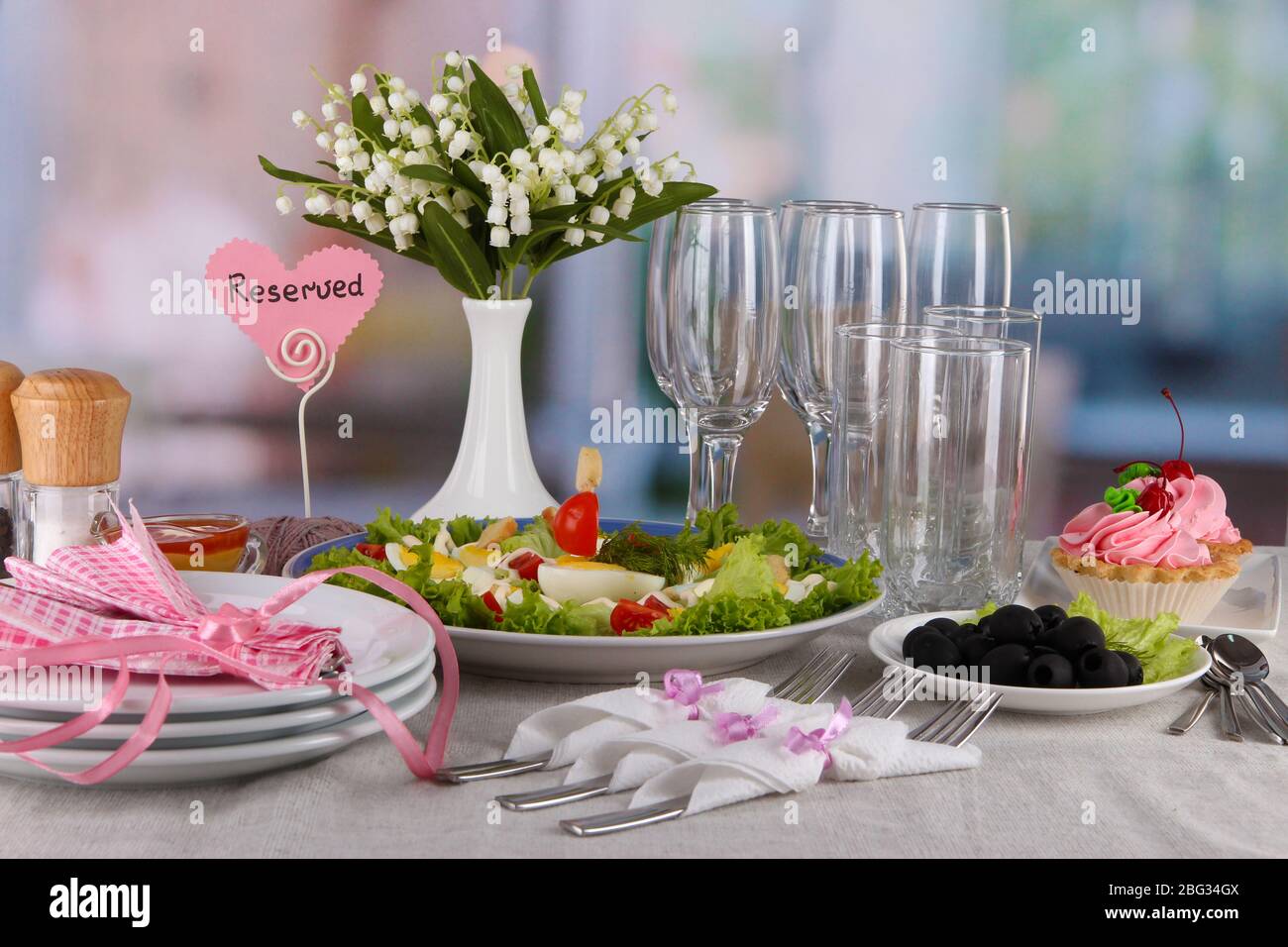 Table setting on room background Stock Photo - Alamy