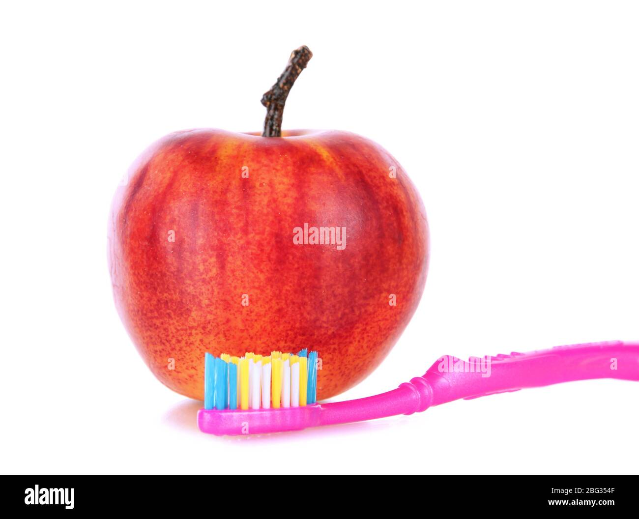 Apple with a toothbrush isolated on white Stock Photo - Alamy