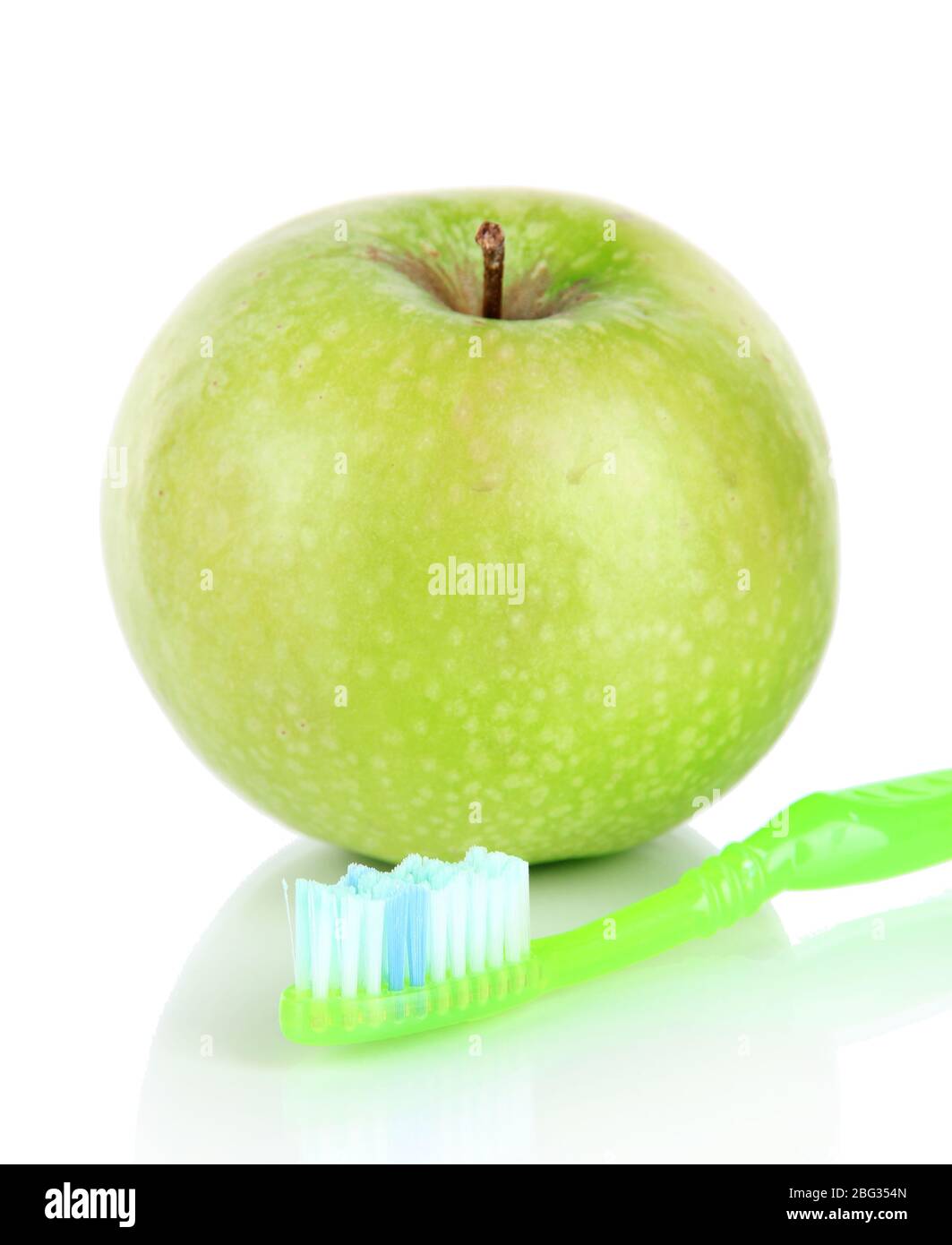 Apple with a toothbrush isolated on white Stock Photo - Alamy