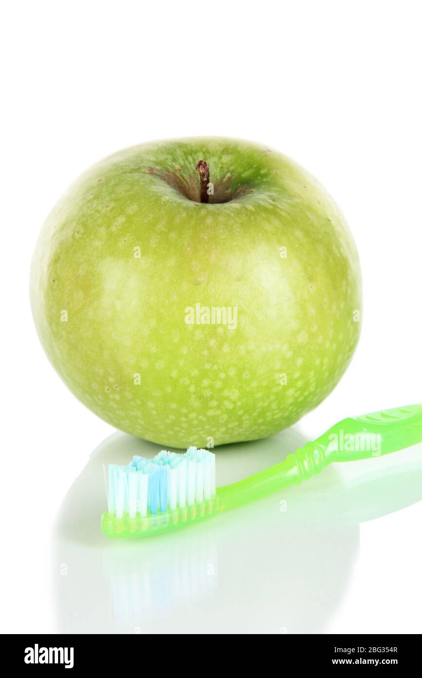 Apple with a toothbrush isolated on white Stock Photo - Alamy