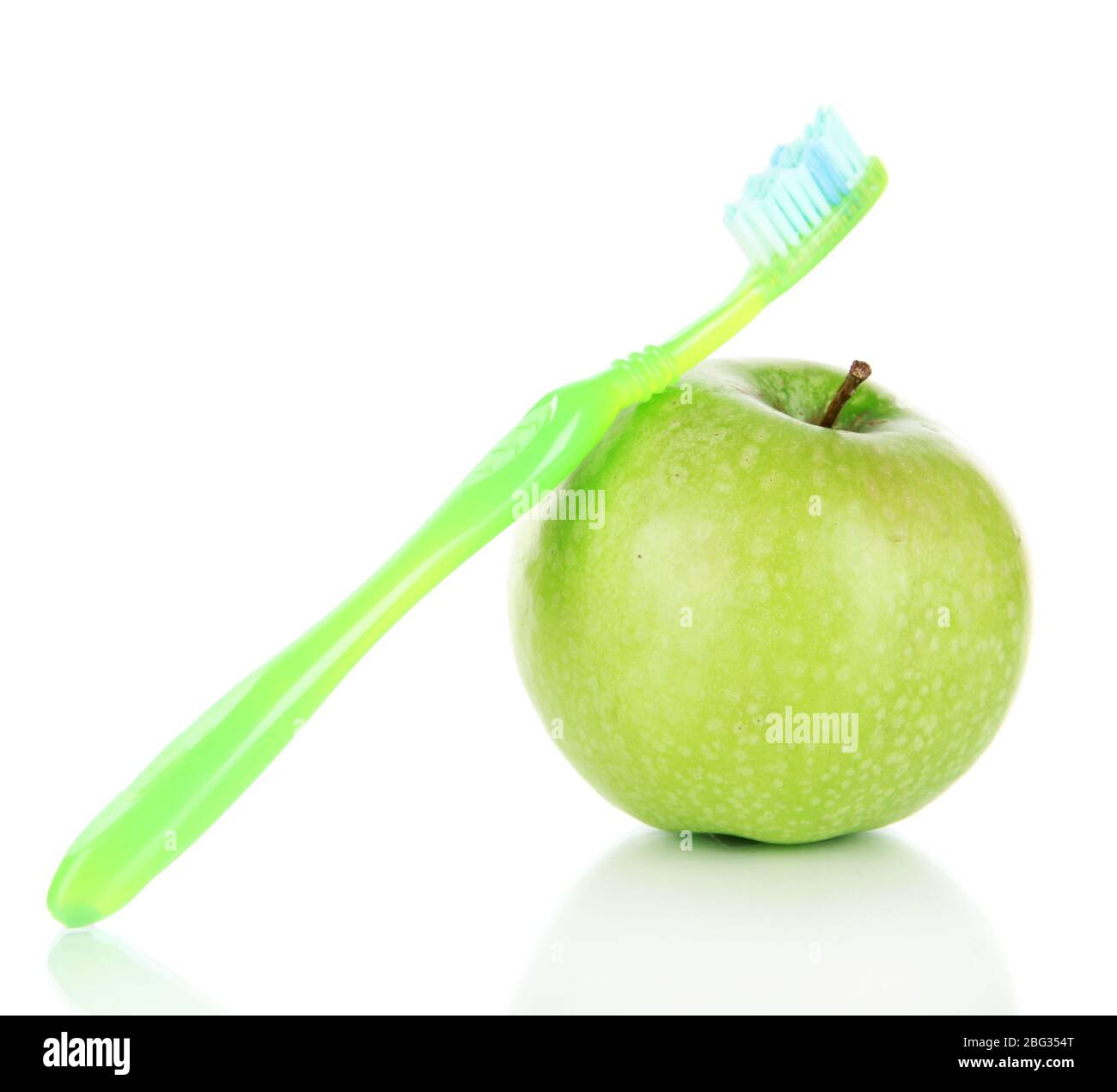 Apple with a toothbrush isolated on white Stock Photo - Alamy