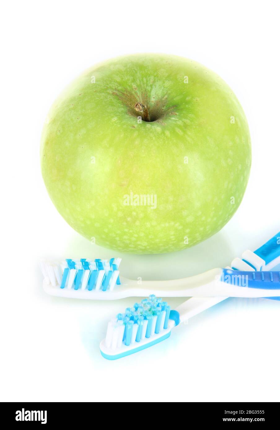 Apple with a toothbrush isolated on white Stock Photo - Alamy