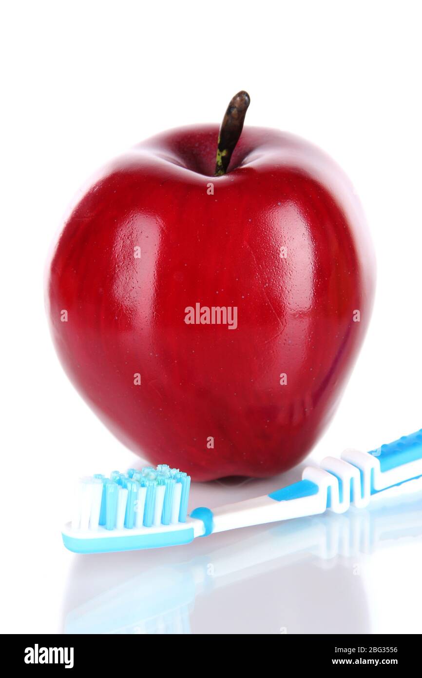 Apple with a toothbrush isolated on white Stock Photo - Alamy